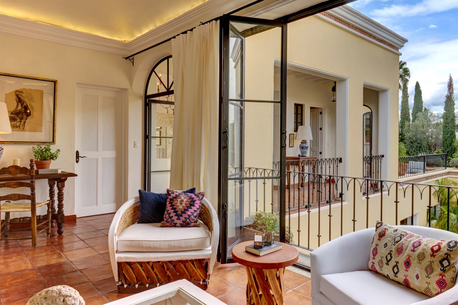Principal seating area looks over entry courtyard